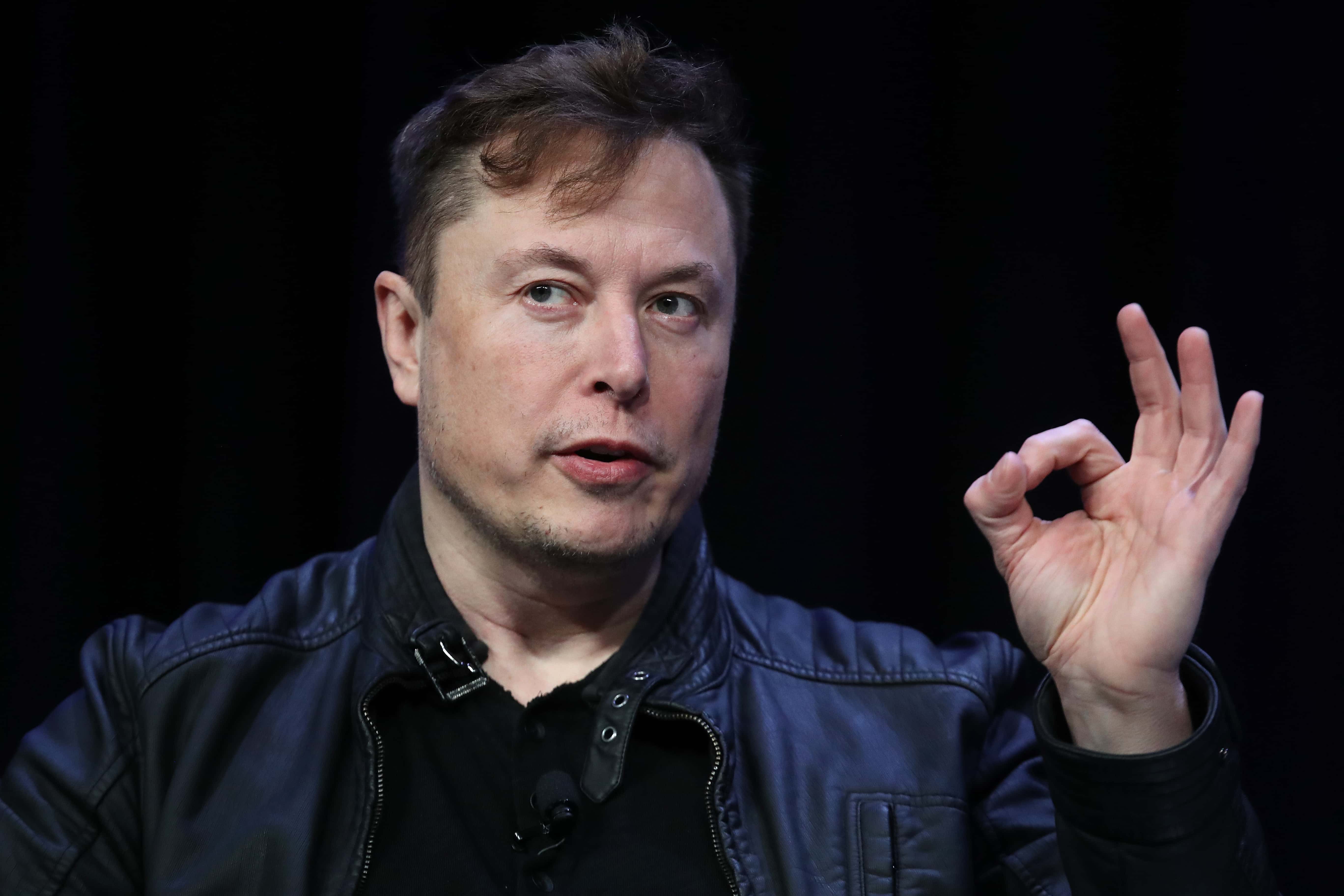 Elon Musk says Ghislaine Maxwell photobombed him when confronted with ...