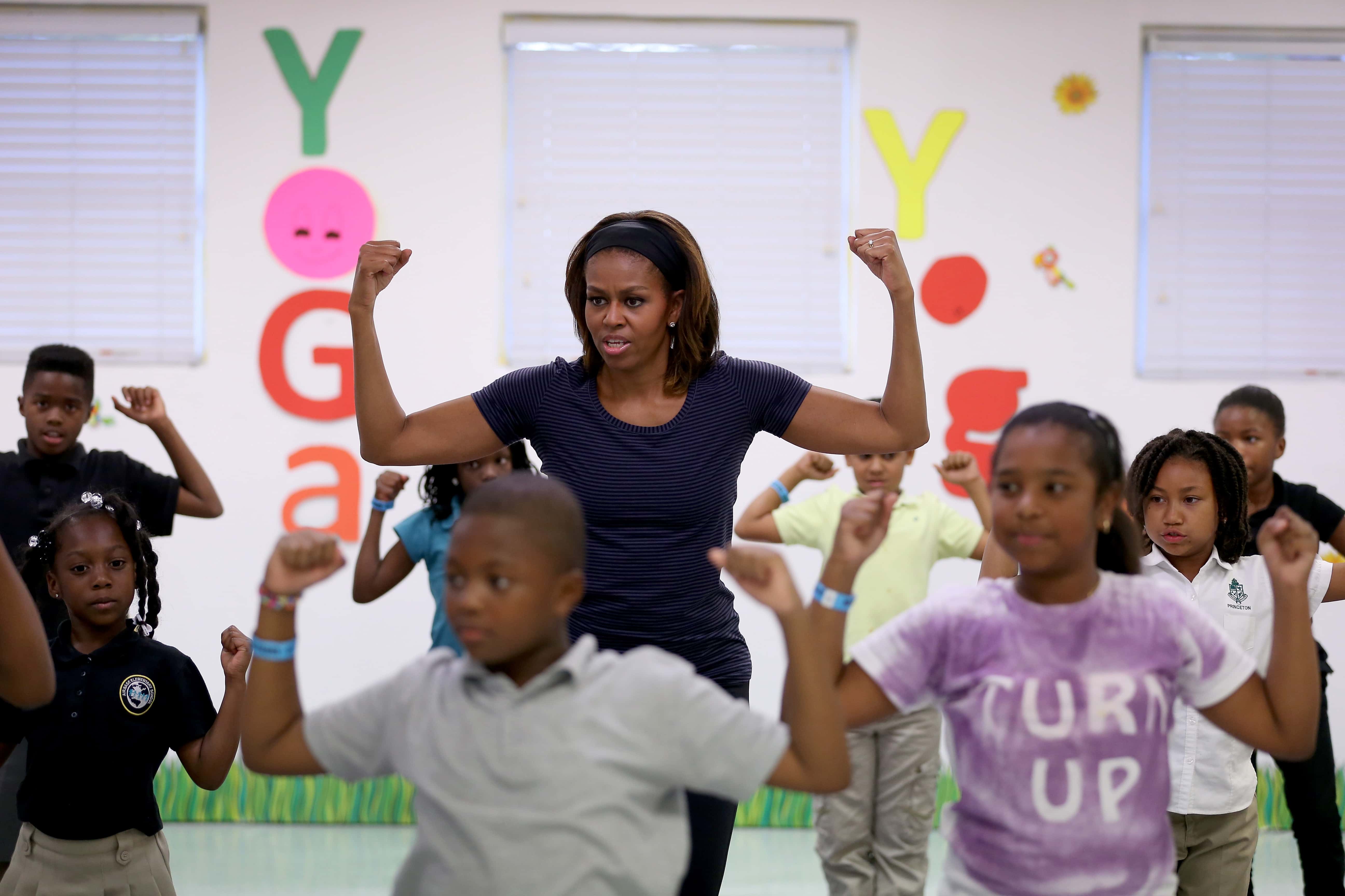 Michelle Obama shows off incredibly toned midriff in workout photo ...